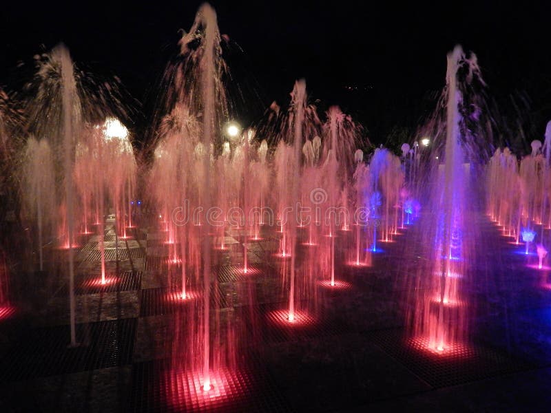 Illuminated Fountains Spring from the Ground Stock Image - Image of lighting, growth: 377893271