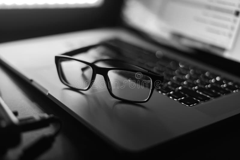 Glasses and a Laptop on the Table Stock Image - Image of computer ...