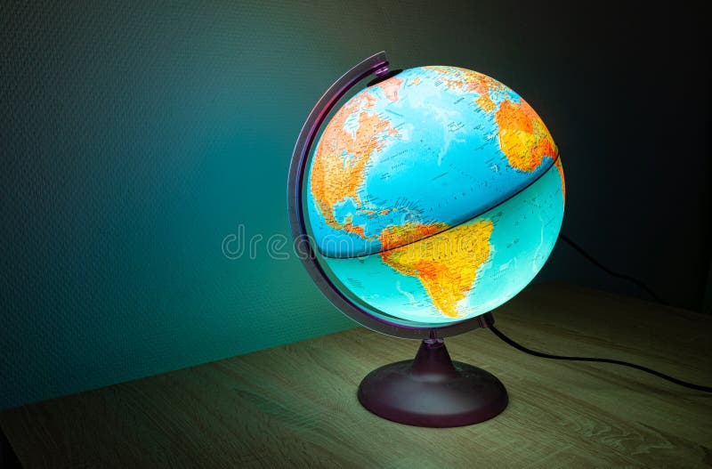 Illuminated Globe on a Desk Stock Photo - Image of globe, sphere: 301805492