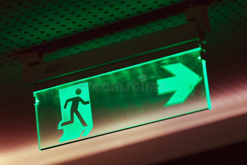 Illuminated Green Emergency Exit Sign Stock Image - Image of escape ...