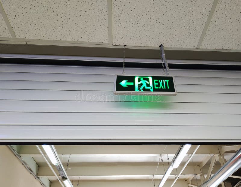 Illuminated Green Exit Sign or Fire Escape Sign. Stock Image - Image of ...