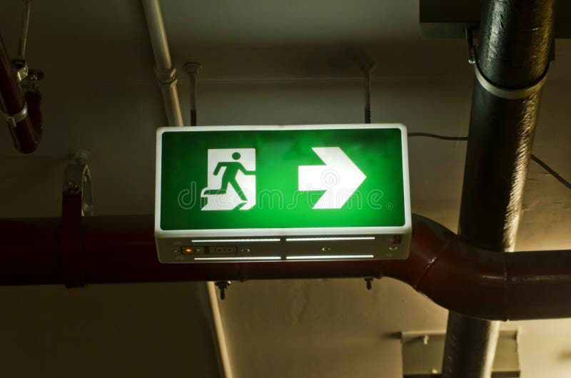 Illuminated Green Exit Sign. Stock Photo - Image of depart, bipedal ...