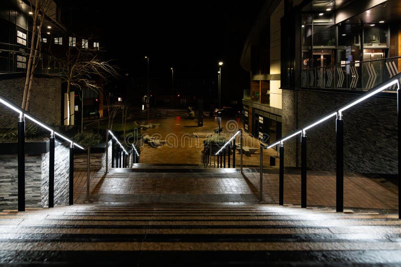 Illuminated Handrails Guiding Down Steps in Urban Nightscape Stock ...