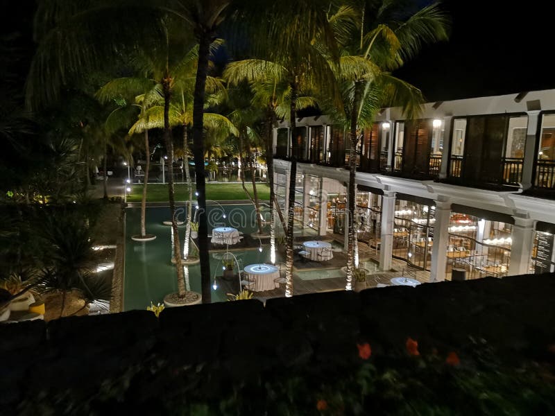 Illuminated Hotel by Water Feature at Night Stock Image - Image of ...