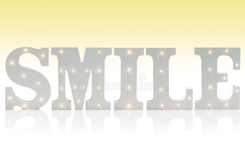 Illuminated Letters Spelling SMILE Over Gradient Yellow-White Ba Stock ...