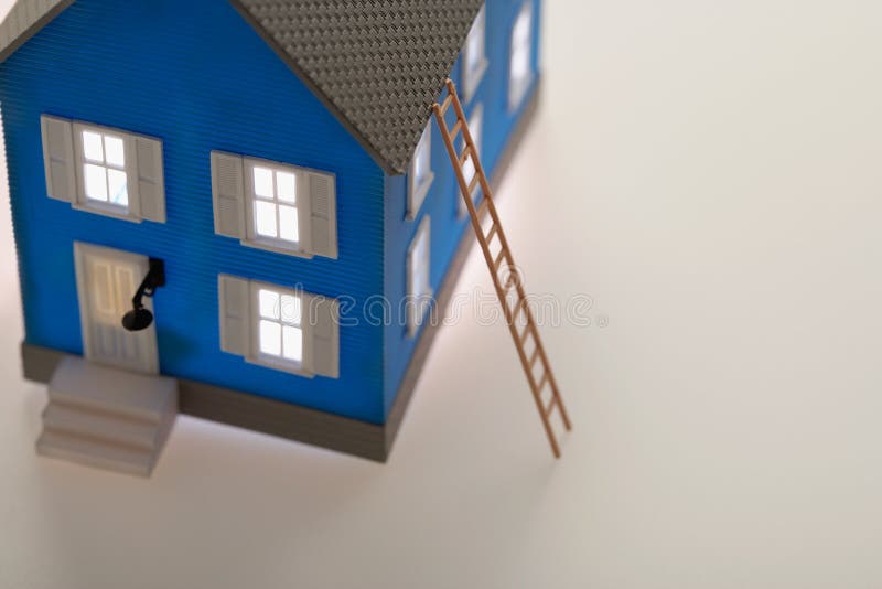 Illuminated Little Blue Model House with Ladder Stock Image - Image of ...