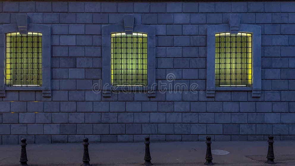 Illuminated Louvered Windows at Dusk Stock Image - Image of dusk, night ...
