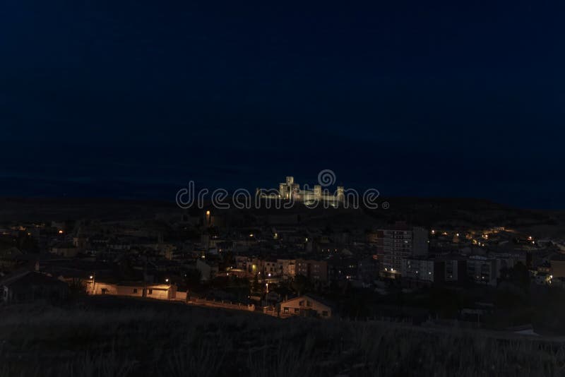 Medieval Castle Dominating a Quiet Spanish Town Under a Deep Night Sky ...