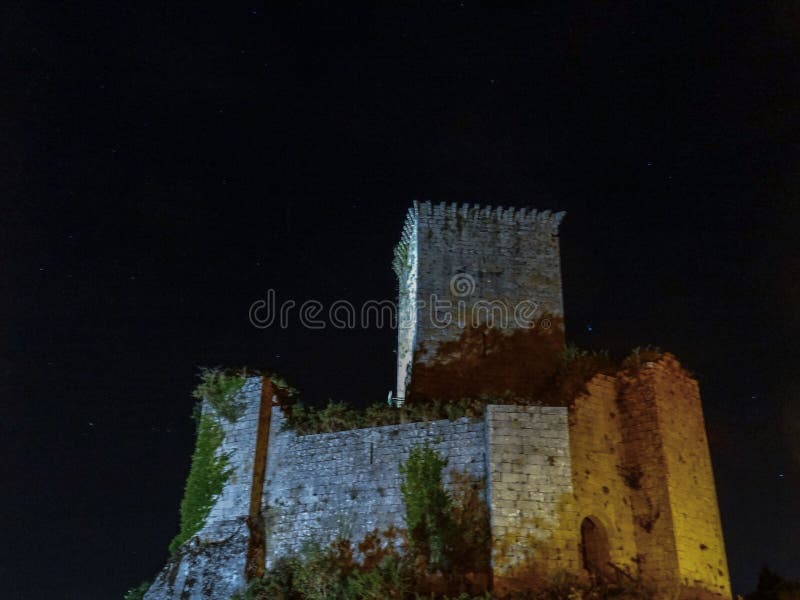 A Castle that Has a Tower on Top of it at Night Stock Image - Image of ...