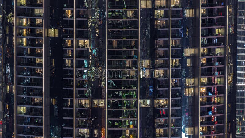 Windows in Apartments of a High Class Building at Night Timelapse Stock ...
