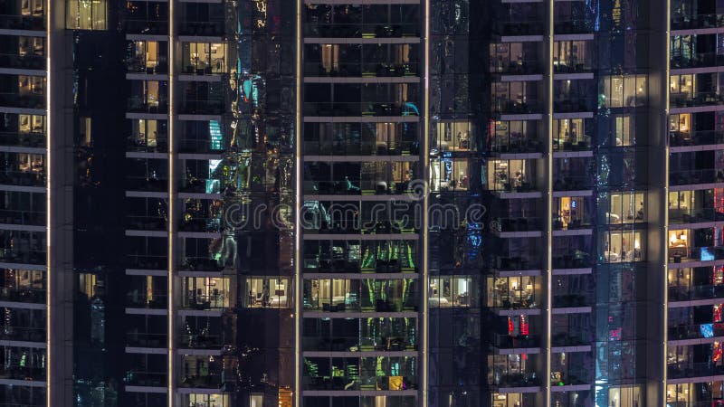 Windows in Apartments of a High Class Building at Night Timelapse Stock ...