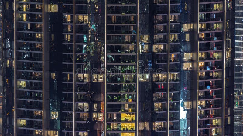 Windows in Apartments of a High Class Building at Night Timelapse Stock ...