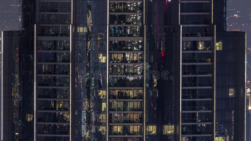 Windows in Apartments of a High Class Building at Night Timelapse Stock ...