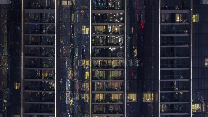 Windows in Apartments of a High Class Building at Night Timelapse Stock ...