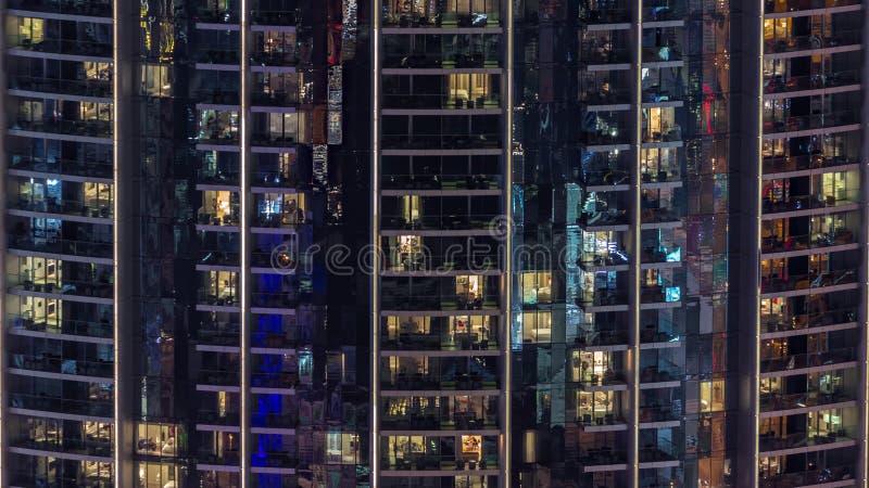 Windows in Apartments of a High Class Building at Night Timelapse Stock ...
