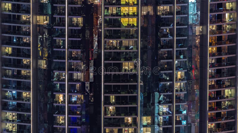 Windows in Apartments of a High Class Building at Night Timelapse Stock ...