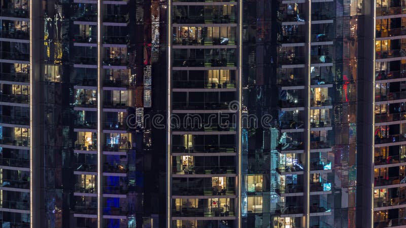 Windows in Apartments of a High Class Building at Night Timelapse Stock ...