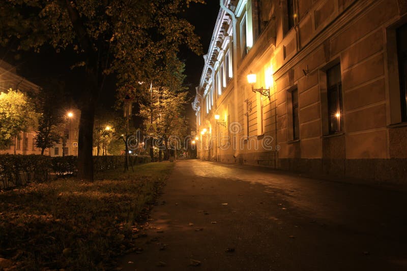 Sidewalk on a night street stock photo. Image of lamps - 104951176