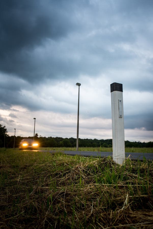 Illuminated Pole on Roadside Stock Image - Image of protection, road ...