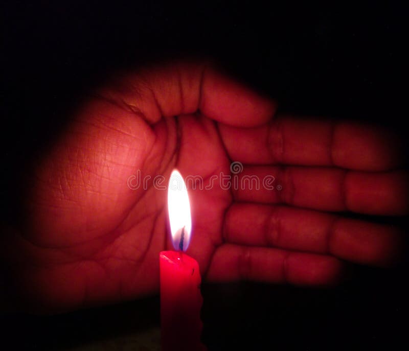 Illuminated Red Candle Protected by Hand Stock Image - Image of quail ...