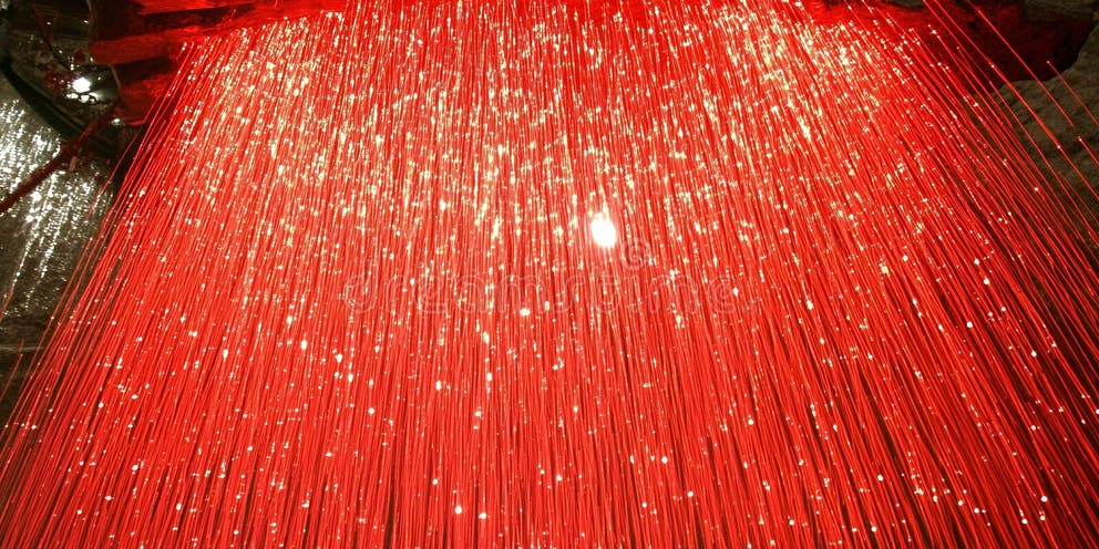Illuminated Red Fiber Optic Threads Cascading Downward Creating a ...