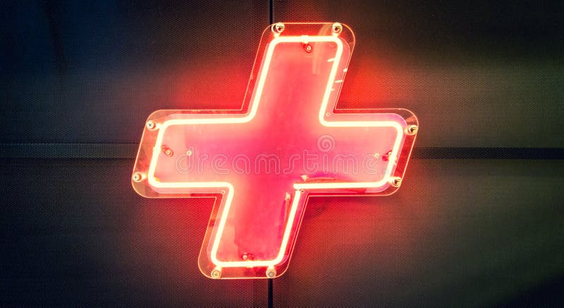 Illuminated Red Neon Light, Plus Symbol on the Wall Stock Image - Image ...