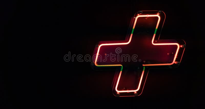 Illuminated Red Neon Light, Plus Symbol on the Wall Stock Image - Image ...
