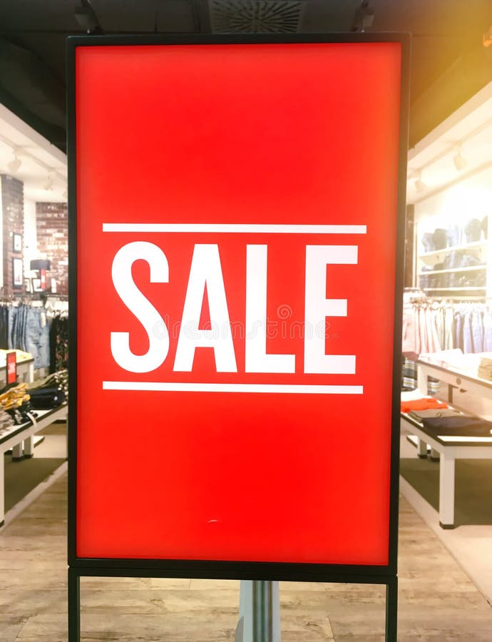 Illuminated SALE Sign Light Box in Front of Clothes Store Stock Image ...