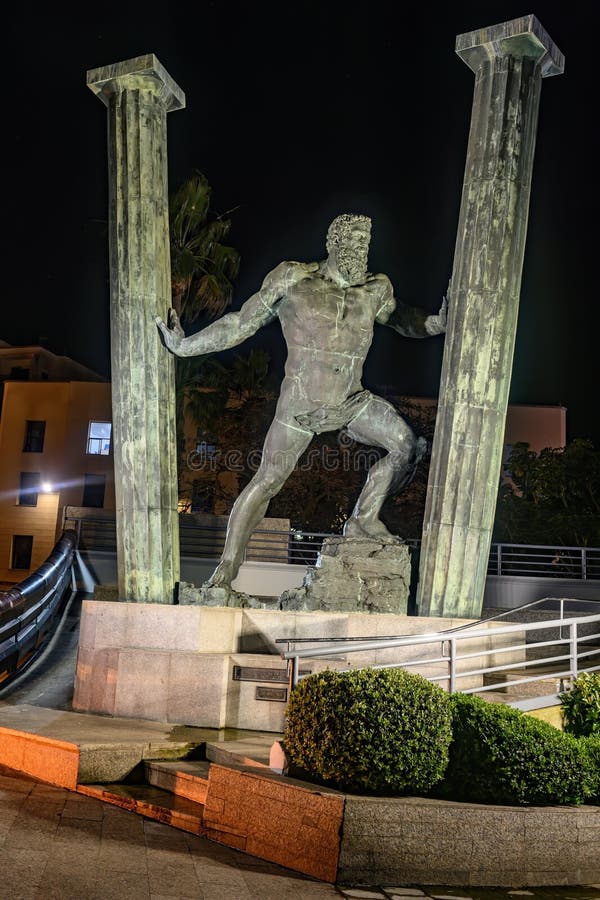 Illuminated Sculpture of Hercules with Classical Columns Stock Photo ...