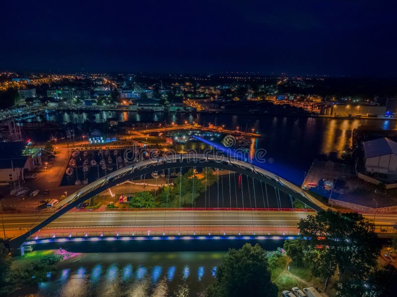 Illuminated Seaport and Bridge from a Drone at Night Stock Image ...