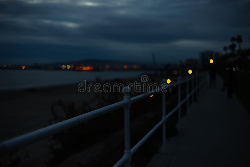 Illuminated Sidewalk Night View Tranquil Ocean Background Stock Photos ...