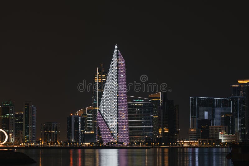 Illuminated Skyscraper in Doha at Night Stock Photo - Image of ...