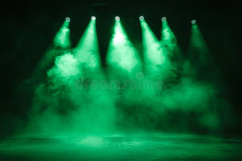 Illuminated Stage with Green Spotlight and Atmospheric Smoke Creating a ...