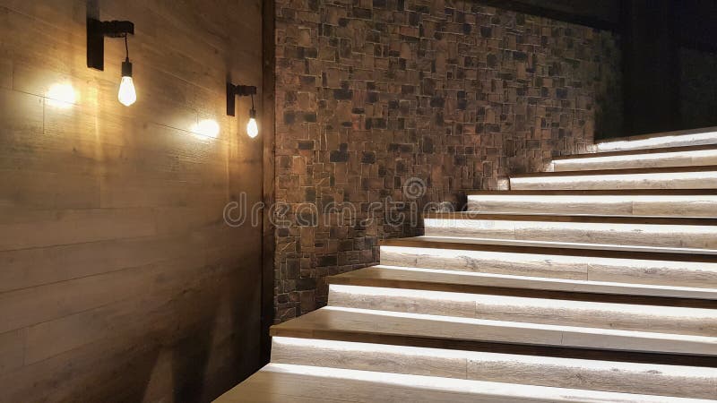 Illuminated Staircase with Wooden Steps and Illuminated at Night in the ...
