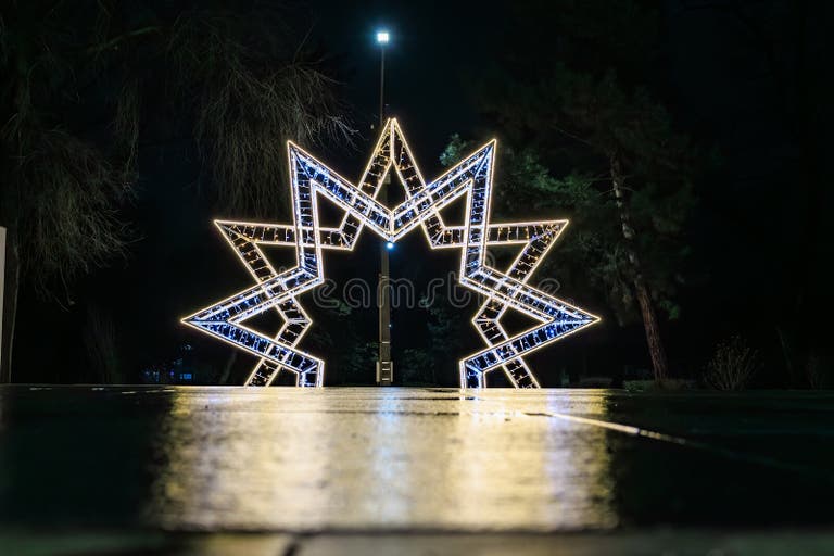 Illuminated Star-shaped Light Display in Nighttime Park Setting Stock ...
