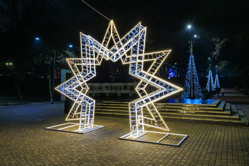 Illuminated Star-shaped Sculpture in a Nighttime Park Setting Editorial ...
