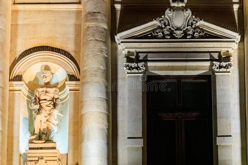 Illuminated Stone Statue and Classical Architecture at Night Stock ...