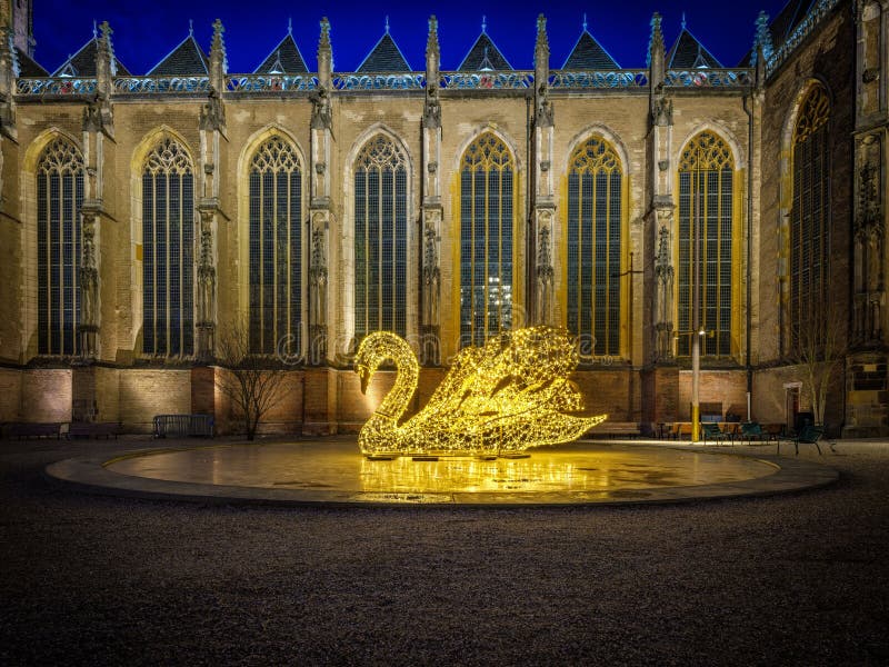 Illuminated Swan On The Old Church Square Of Deventer City In The Netherlands Editorial Image