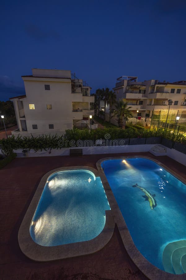 Illuminated Swimming Pools at Night Stock Photo - Image of alcoceber ...