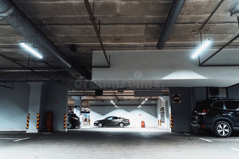 Illuminated Underground Car Parking Interior Under Modern Mall with ...