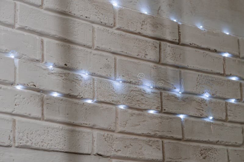 Illuminated White Brick Wall with Soft Blue LED Strips Stock Image ...