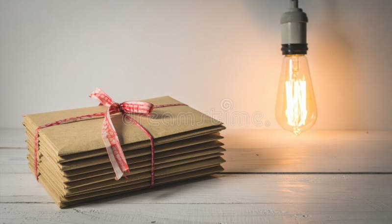 Illuminating Innovation, a Stack of Brown Paper Topped with Glowing ...