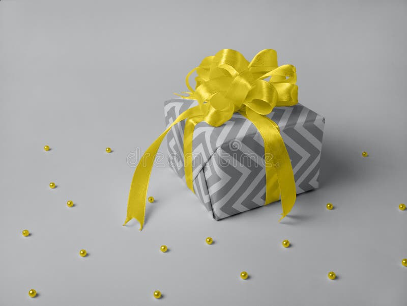 Illuminating Yellow and Ultimate Gray Color 2021. Gift Box with a ...