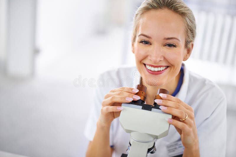 Im Confident Ill Find a Cure. a Beautiful Woman in a Laboratory Working ...