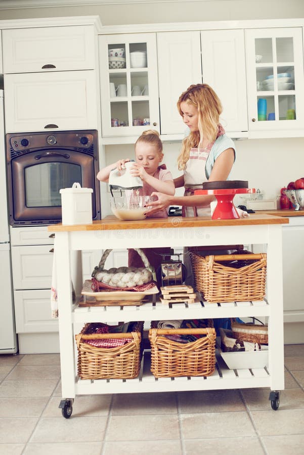 Am Im Doing it Right Mom. Cute Little Girl Baking in the Kitchen at ...