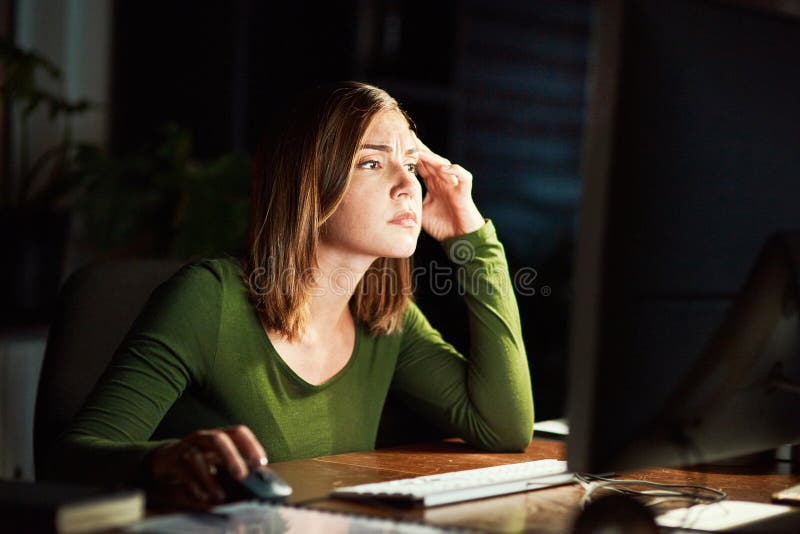 Im Focused on Getting this Done. a Young Woman Using Her Computer while ...