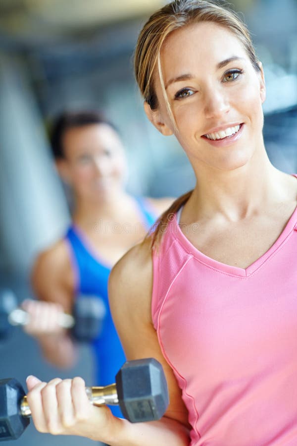 Im Making Great Progress. a Beautiful Young Woman Working Out at the ...