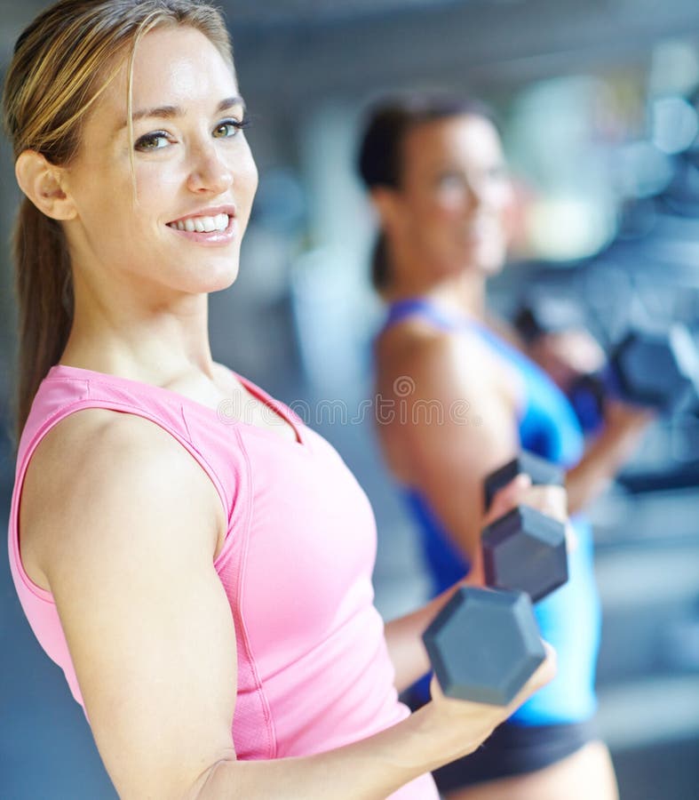 Im Making Great Progress. a Beautiful Young Woman Working Out at the ...