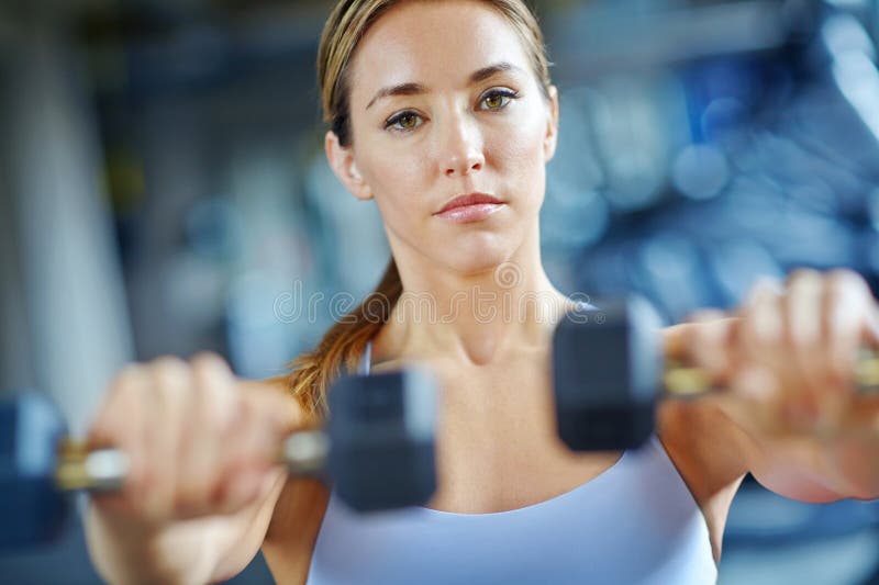 Im Making Great Progress. a Beautiful Young Woman Working Out at the ...