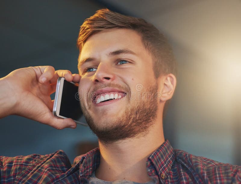 Im on it. a Young Man Using His Cellphone while Working Late in the ...